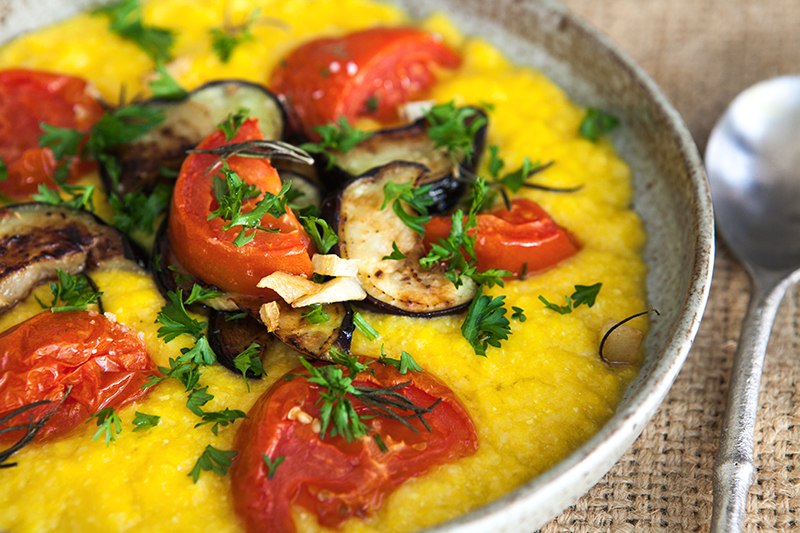 Creamy sweet corn polenta with tomatoes, aubergine and garlic oil ...